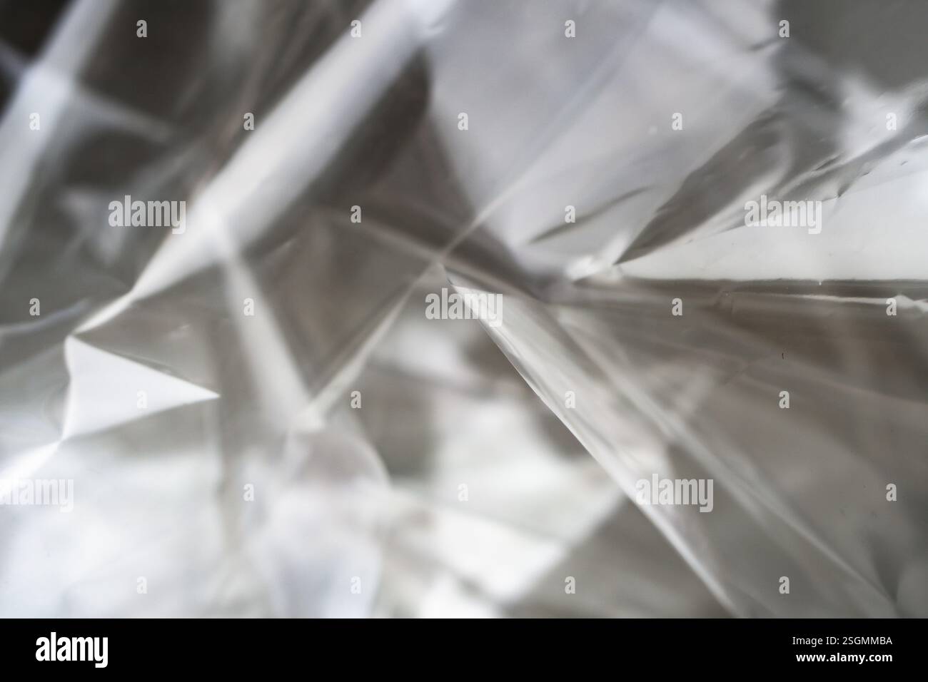 Crumpled clear plastic background, abstract glossy broken surface ...