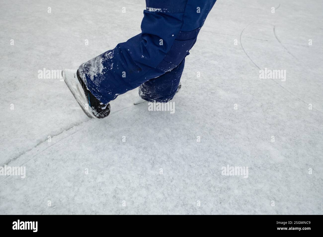 Snow-Covered Ice Skates on a Frozen Rink Stock Photo - Alamy