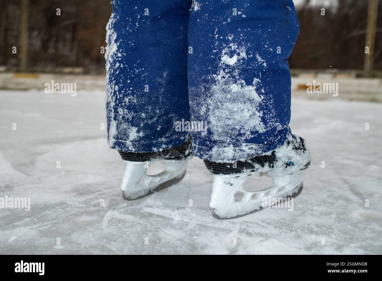 Snow-Covered Ice Skates on a Frozen Rink Stock Photo - Alamy