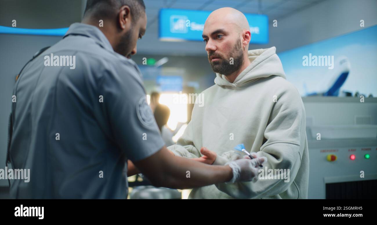 Airport Terminal: African American Security Officer Conducts TSA Hand ...