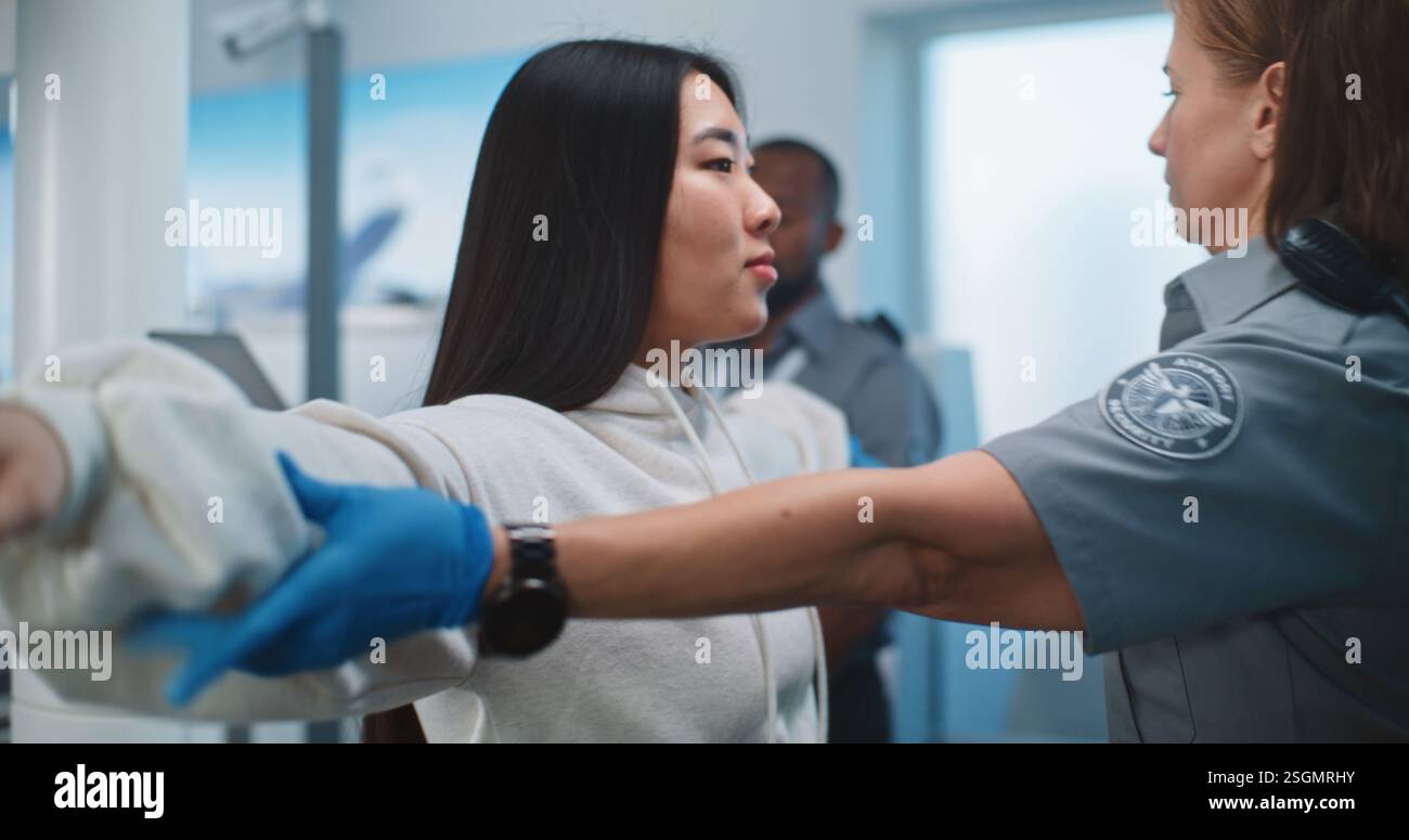 Security Checkpoint in Airport Terminal: Female Security Officer ...