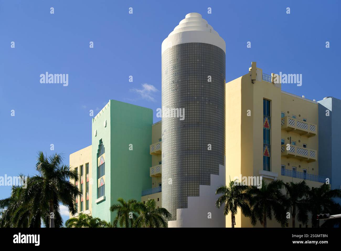 Colorful Art Deco building with a cylindrical glass block tower and ...