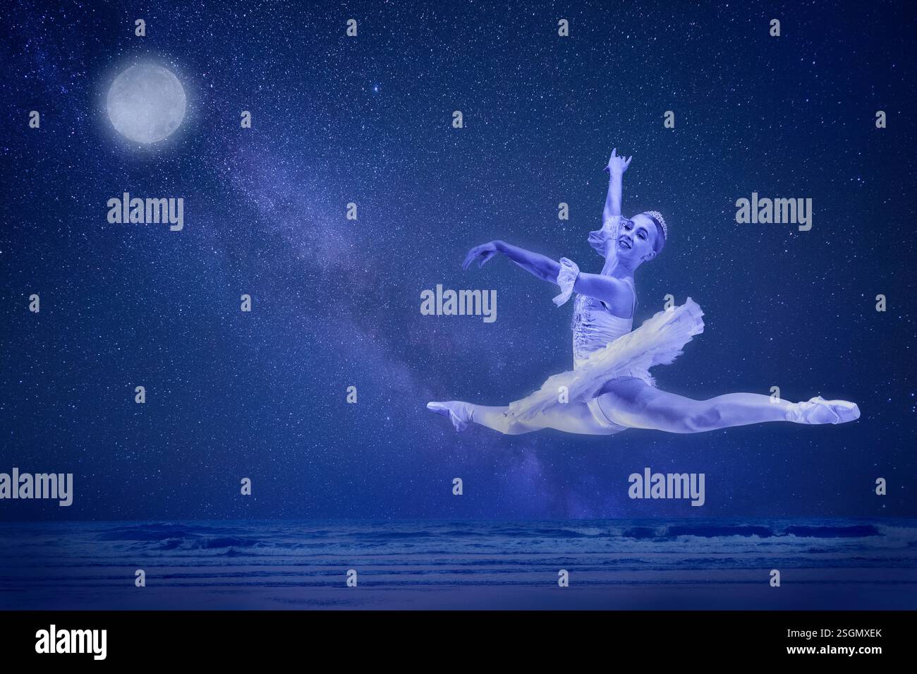 Ballerina in a white tutu gracefully leaps against a starry night sky ...