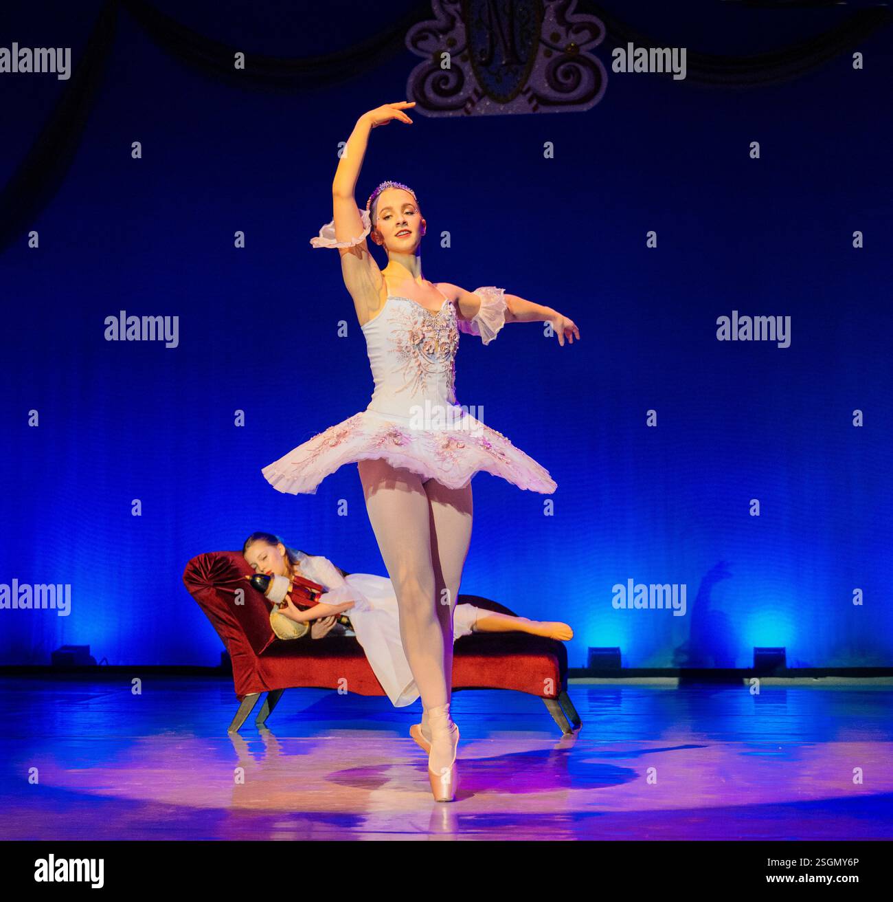 Ballet dancers on stage in elegant costumes with dramatic lighting and ...