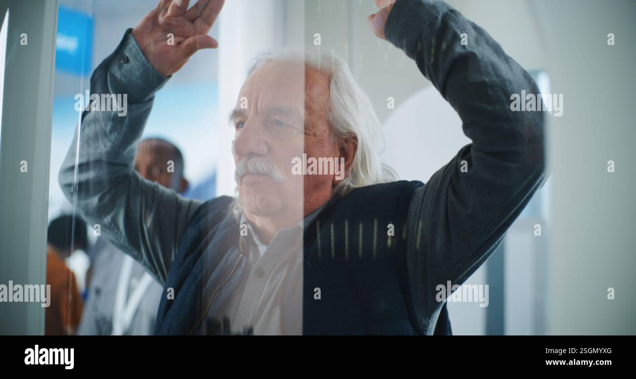 Airport Terminal: Elderly Man Walking Through X-ray Metal Detector ...