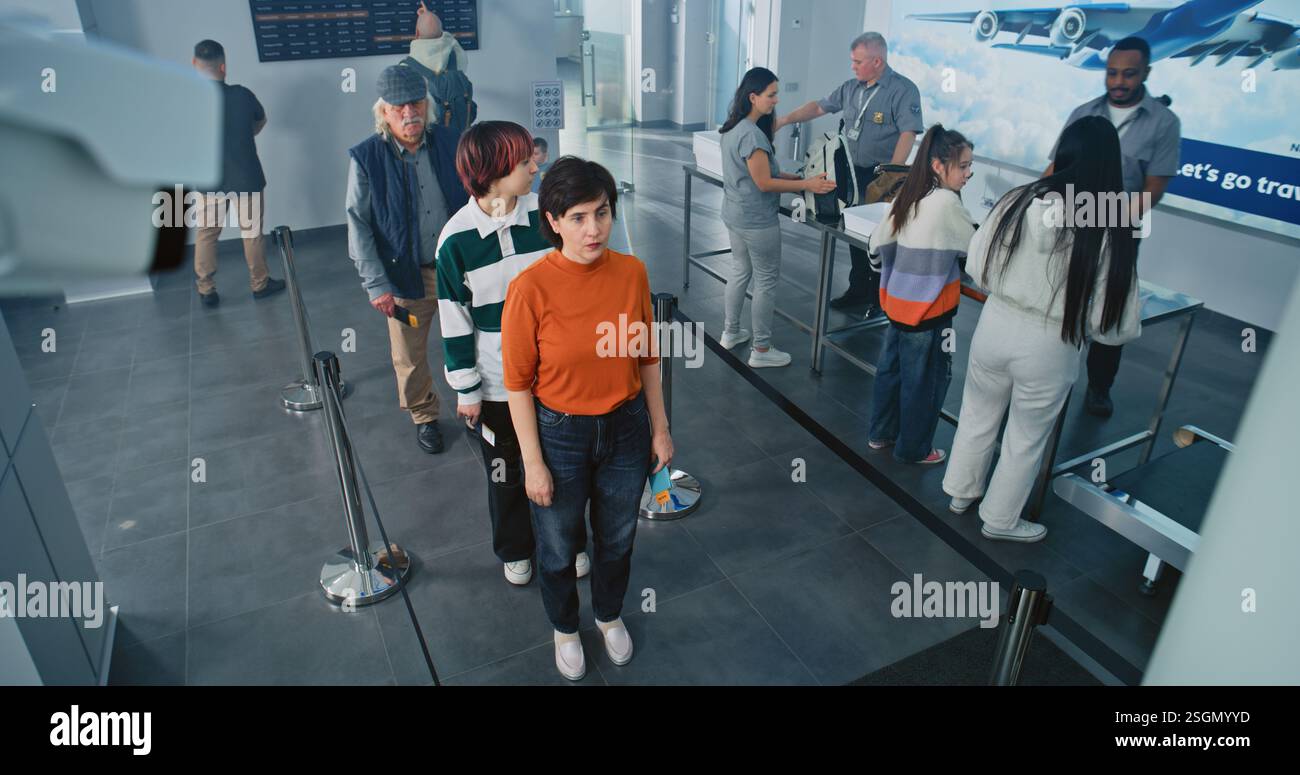 Security Checkpoint in Airport Terminal: Queue of Diverse People ...