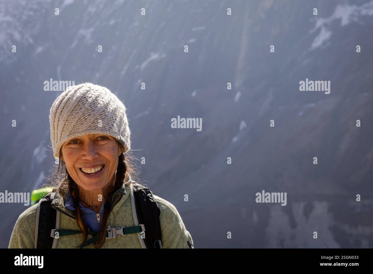Female wears cold weather gear while trekking Nepal Stock Photo - Alamy