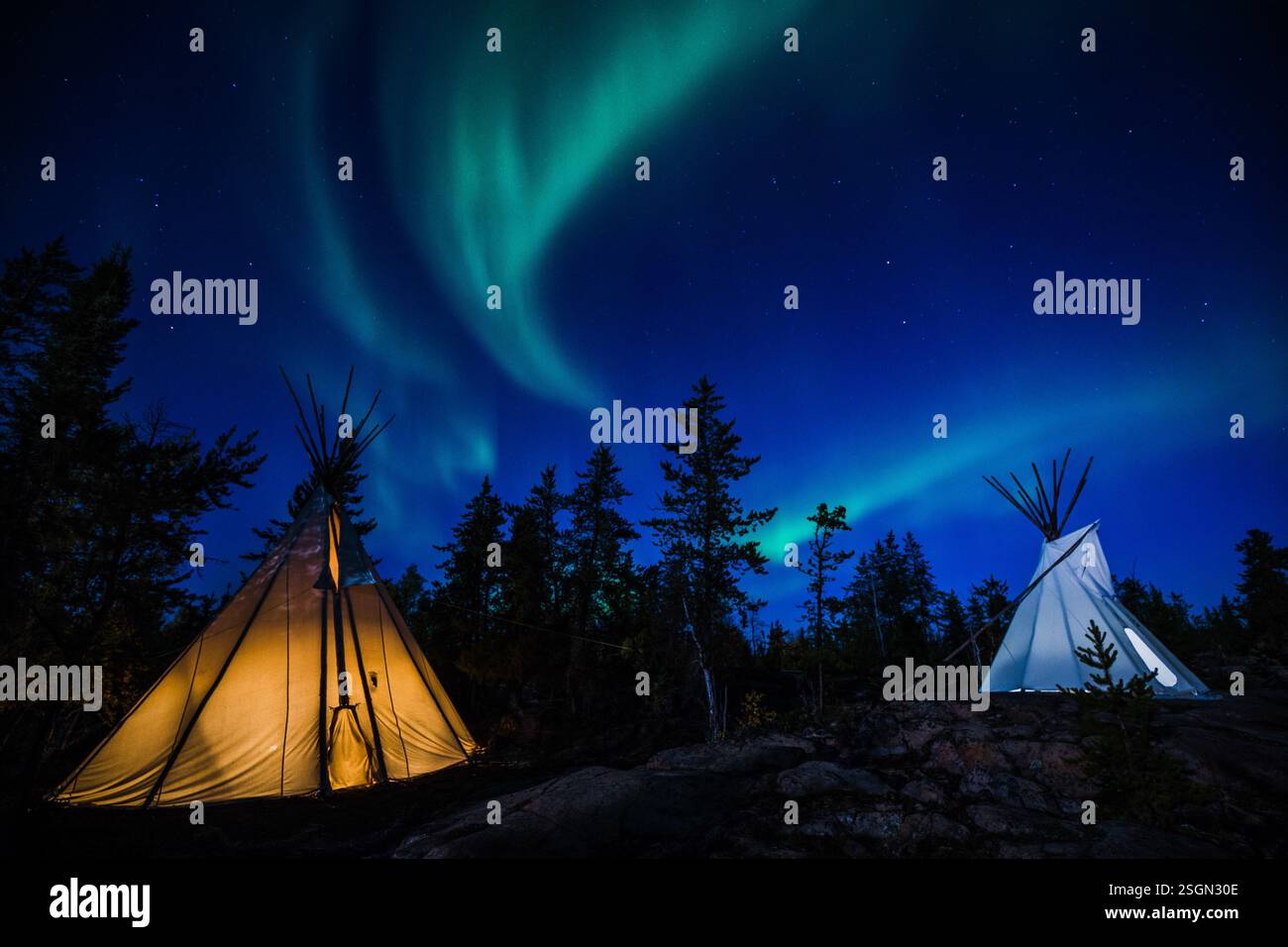 Teepees under aurora appeared in the night sky of Yellowknife in the ...