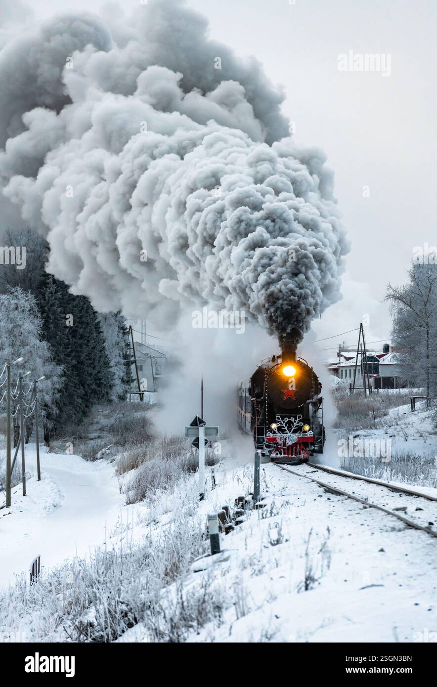 Retro steam locomotive in snowy winter landscape Stock Photo - Alamy