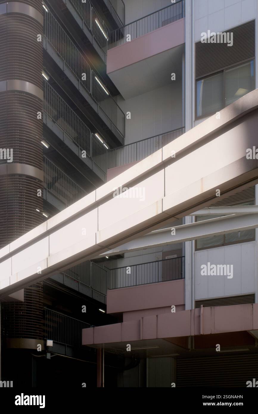 Modern building facade with a skybridge connecting two high-rise ...
