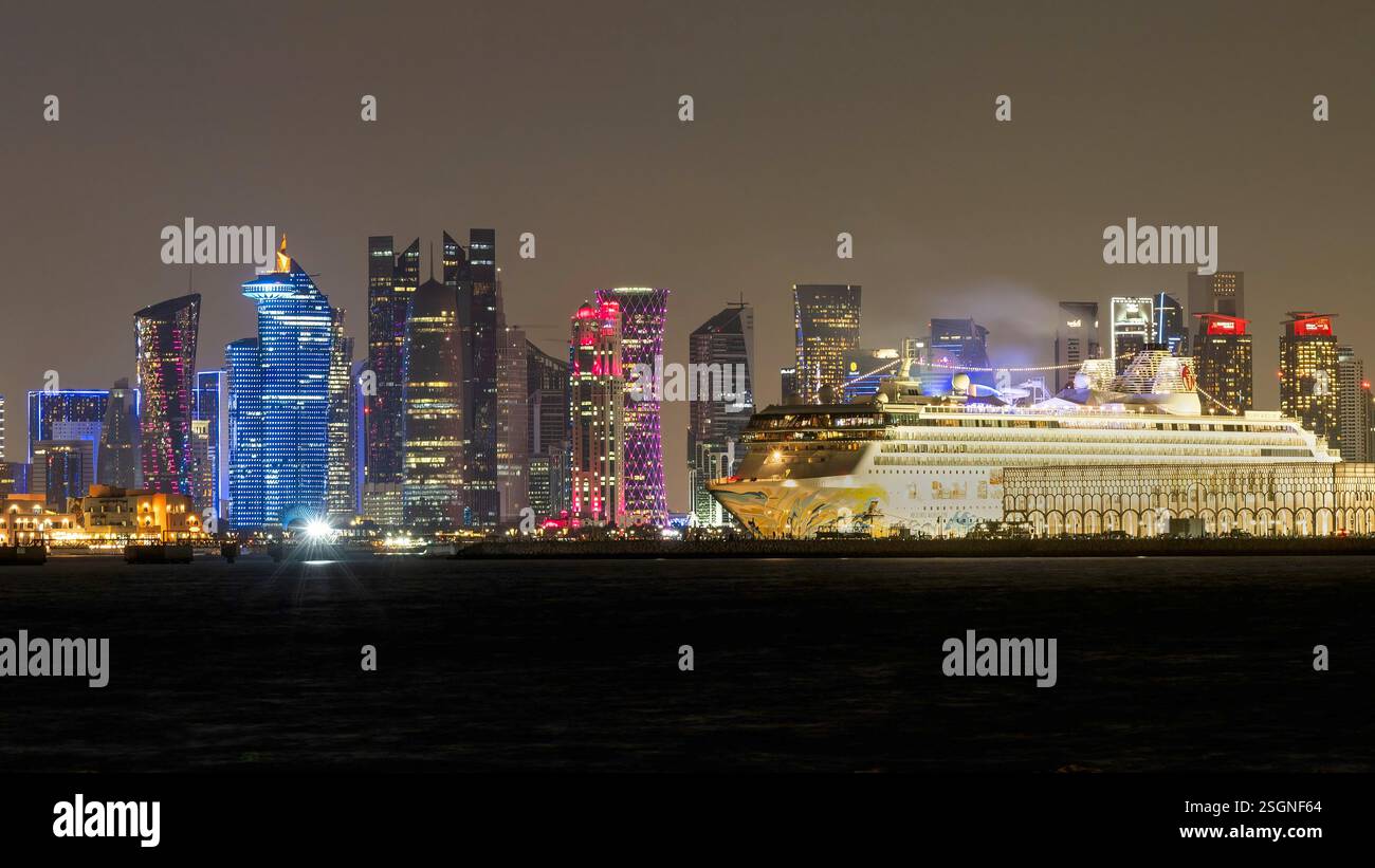 Doha Skyline night view from Mina Port Doha Qatar Stock Photo - Alamy
