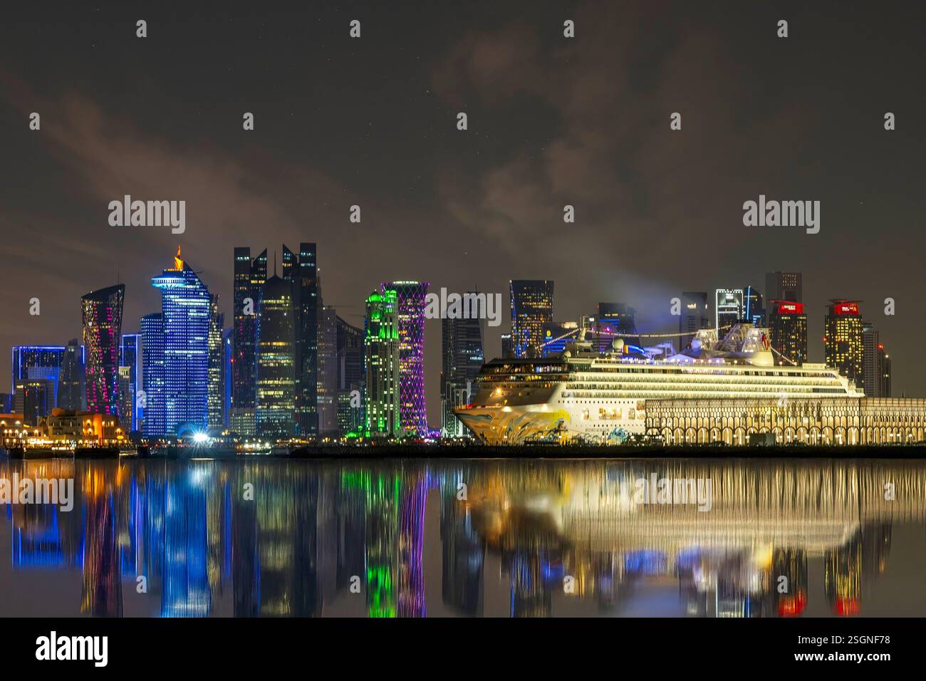 Doha Skyline night view from Mina Port Doha Qatar Stock Photo - Alamy