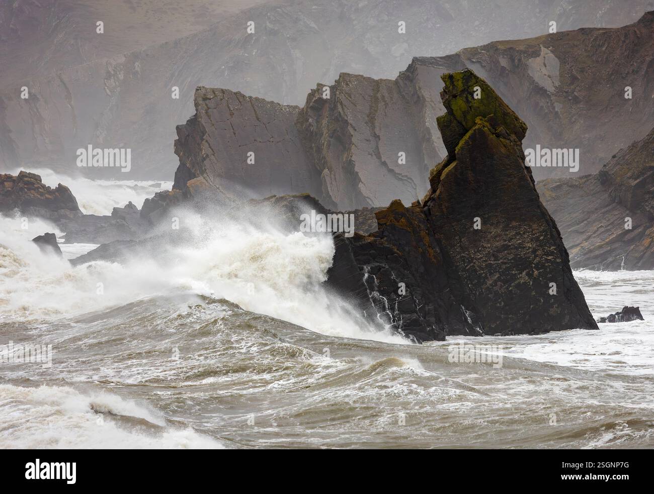 Crashing waves over Bear Rock Storm Eowyn at Hartland Quay Stock Photo ...