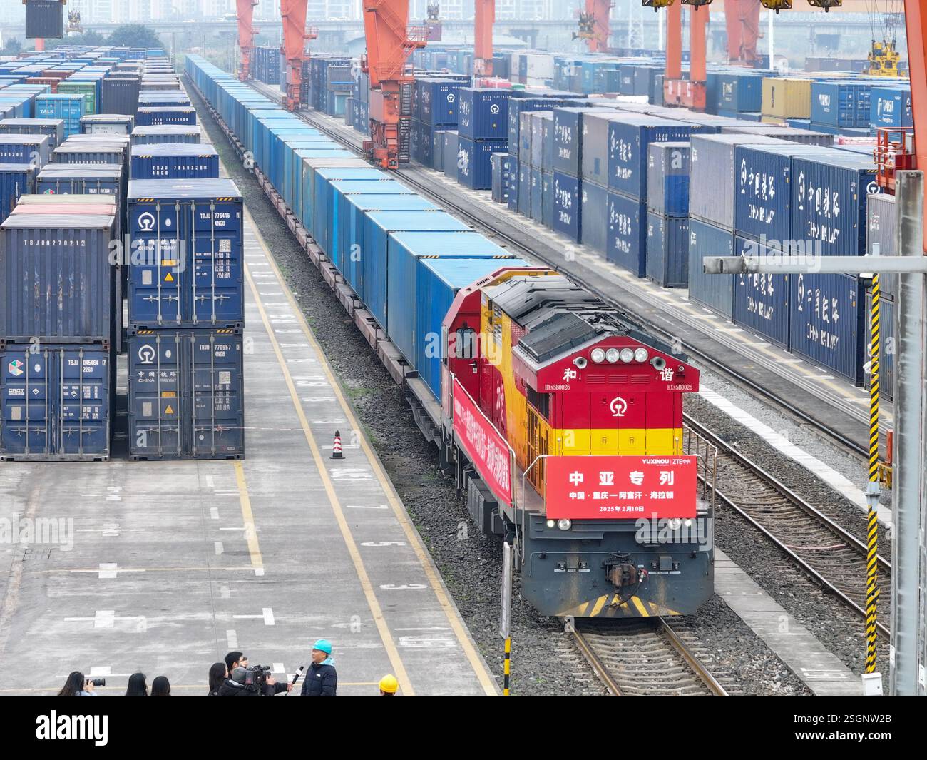 Chongqing, China. 10th Feb, 2025. A drone photo shows a cargo train ...