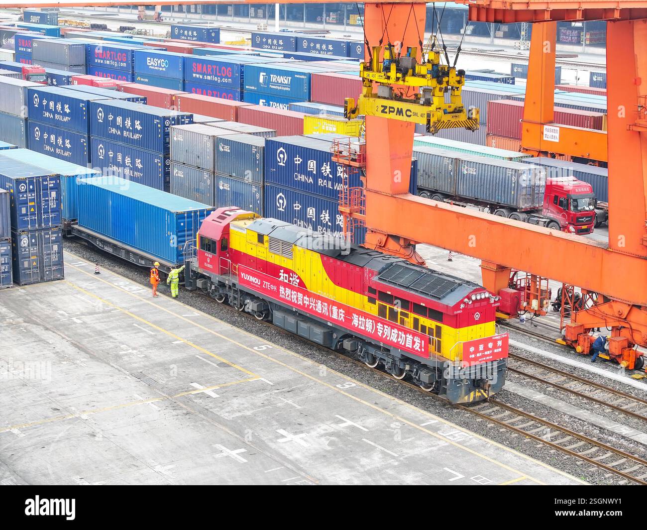 Chongqing, China. 10th Feb, 2025. A drone photo shows a cargo train ...