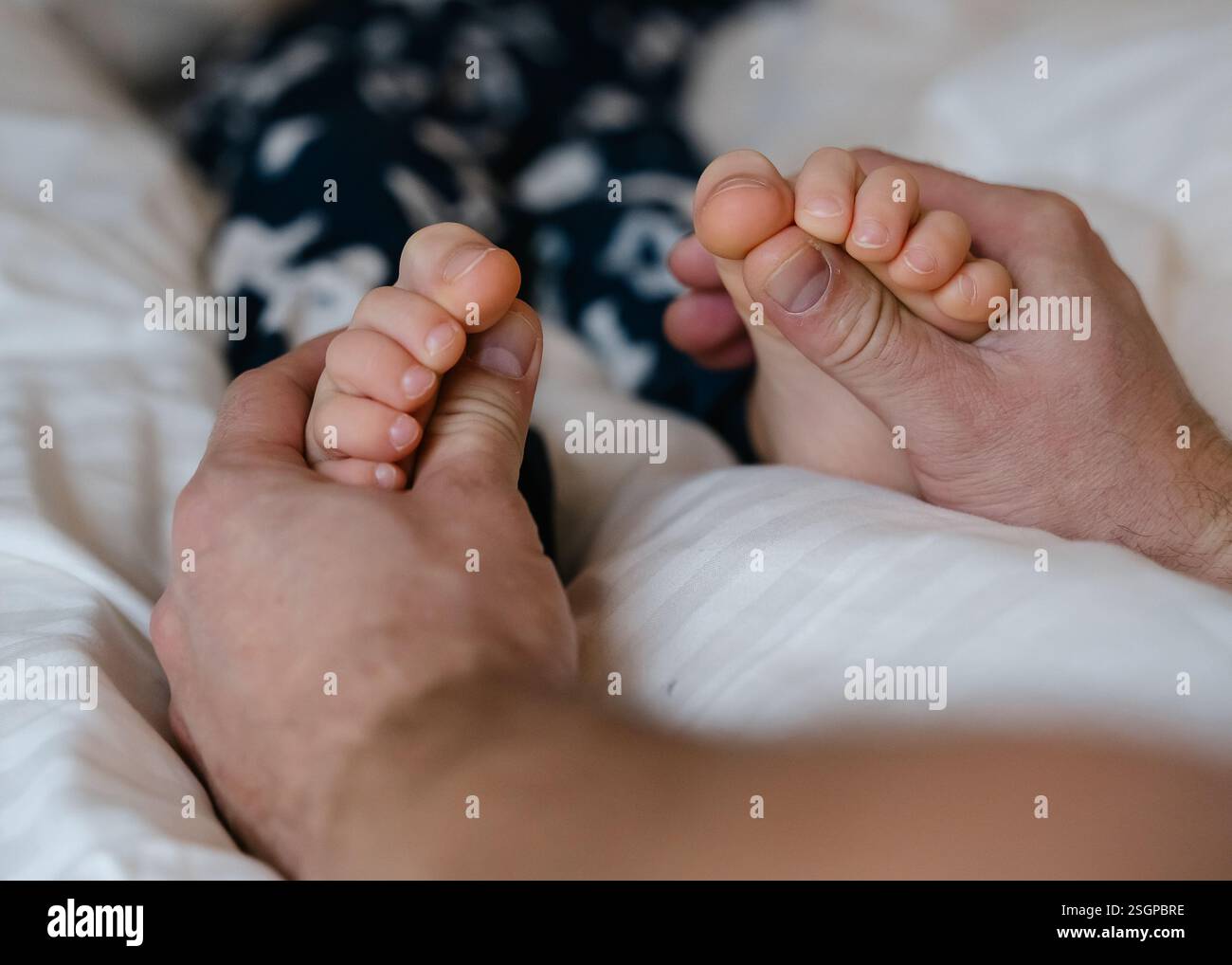 Tickling boy feet hi-res stock photography and images - Alamy