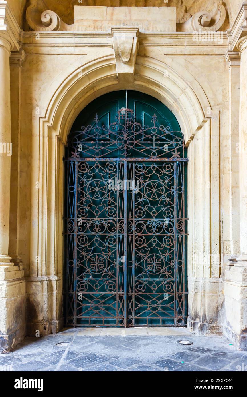 Ornate Iron Gate of a Historic Arched Entrance on Stone Structure Stock ...