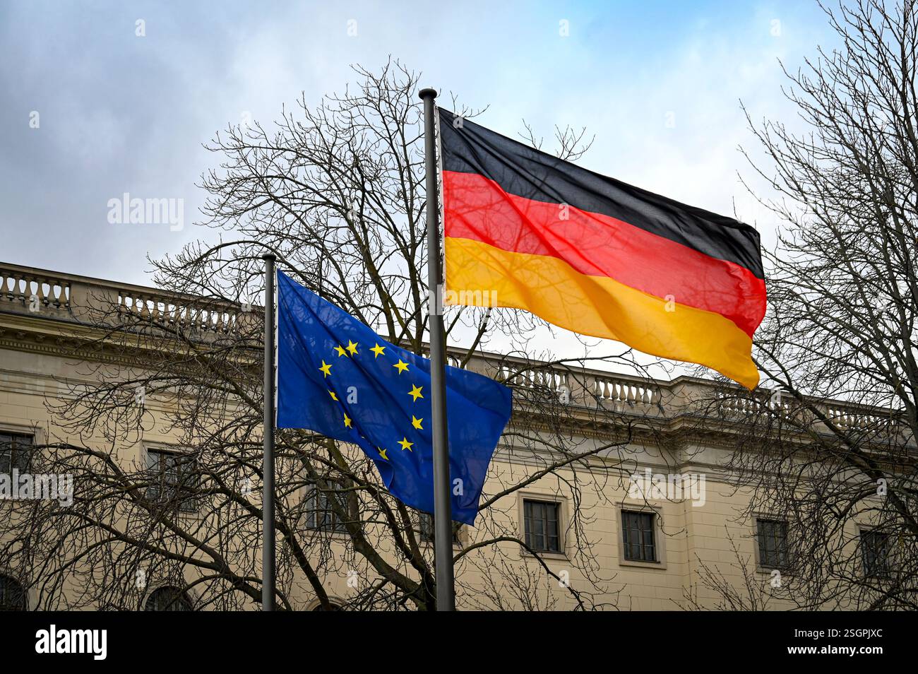 Flags of EU and Germany waving on flagpole in Berlin Stock Photo - Alamy