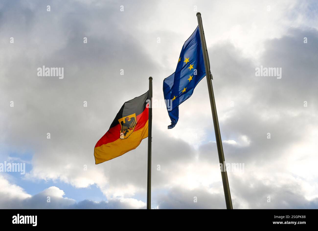 Flags of EU and Germany waving on flagpole in Berlin Stock Photo - Alamy