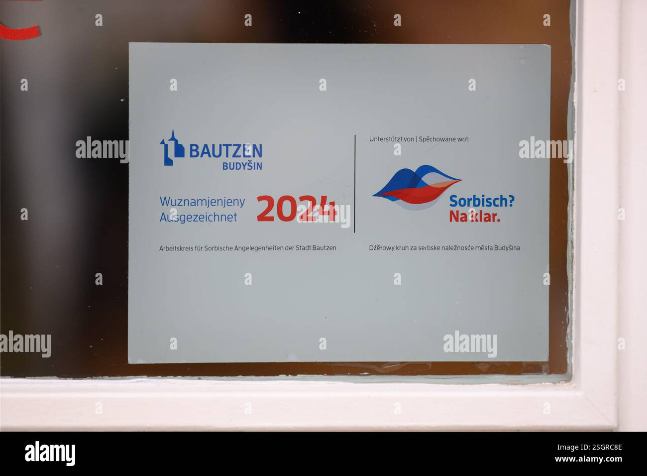 10 February 2025, Saxony, Bautzen: A plaque for the "Sorbian" campaign ...