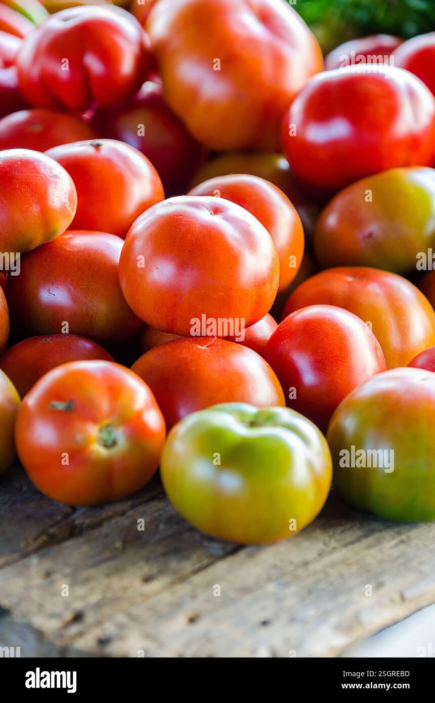 A selection of fresh Italian tomatoes displayed at the fruit market ...