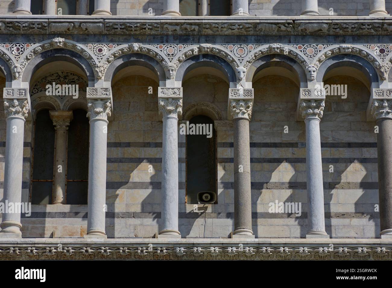 Photo of the medieval romanesque arcades on the fascade of the ...