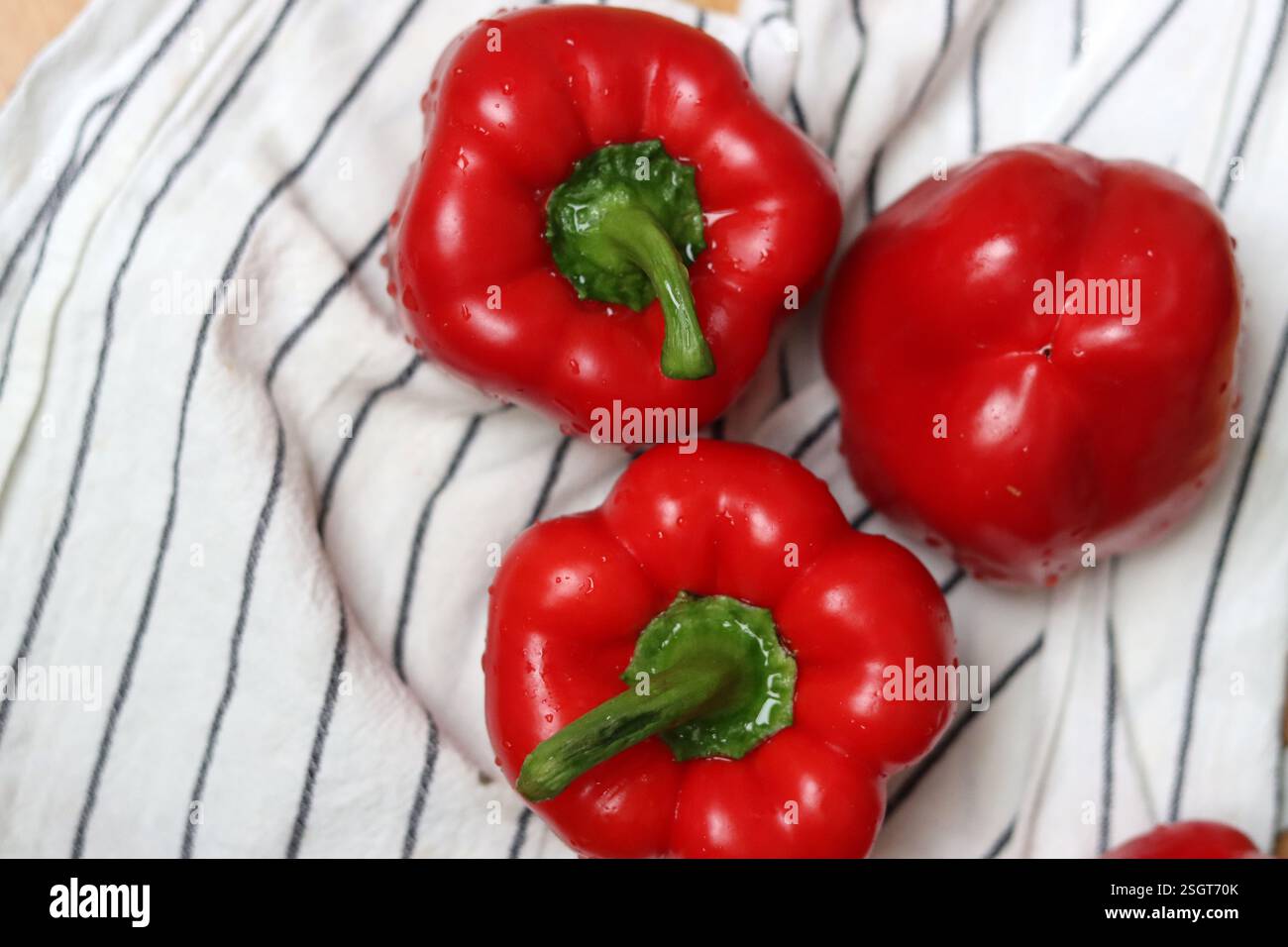 Red bell peppers close up. Shallow depth of field. Fresh vegetables on ...