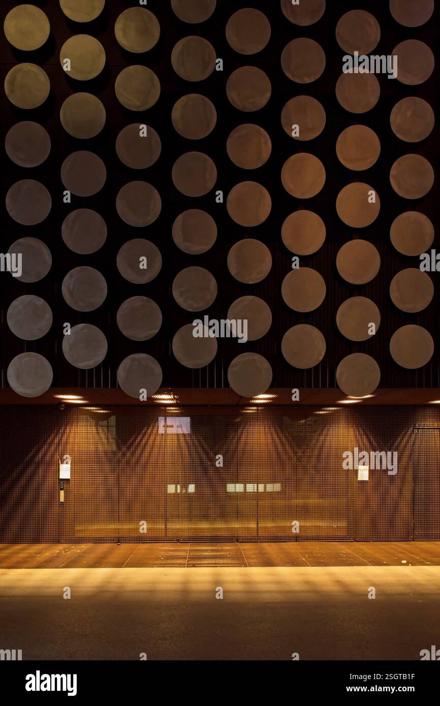 Wall of modern building exterior at night, A wall of a building ...