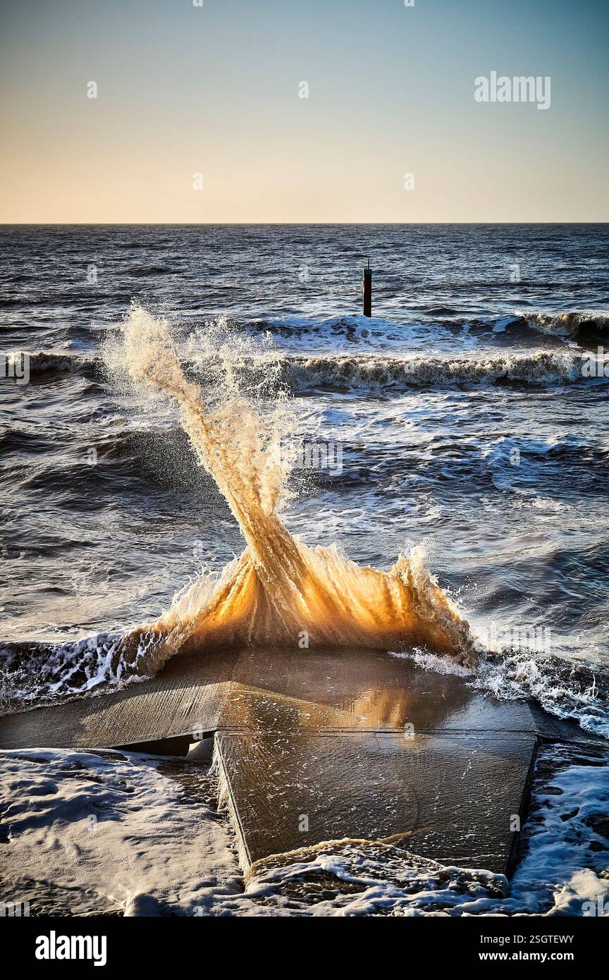 Action of the sea against concrete wave breaker installed on coast ...