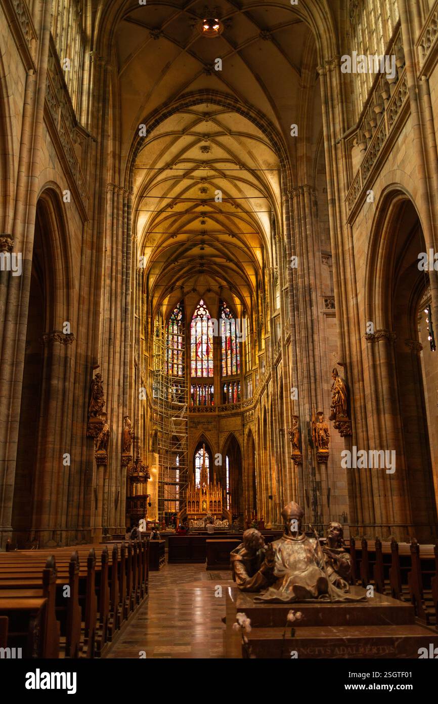 Interior of Gothic Cathedral inside. Carved pulpit, stained-glass ...