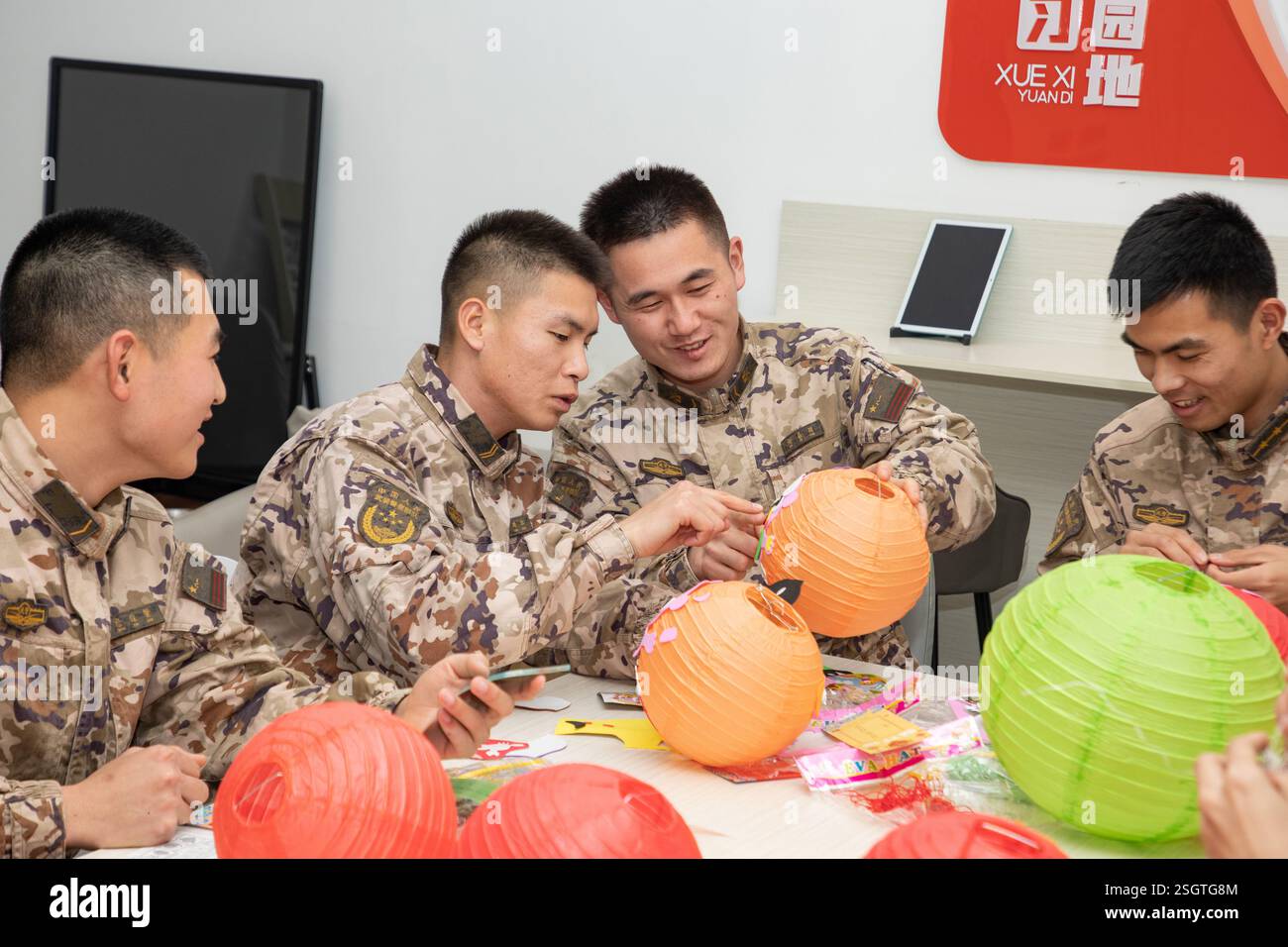 Armed police officers make lanterns to celebrate the upcoming Lantern Festival in Hezhou city ...