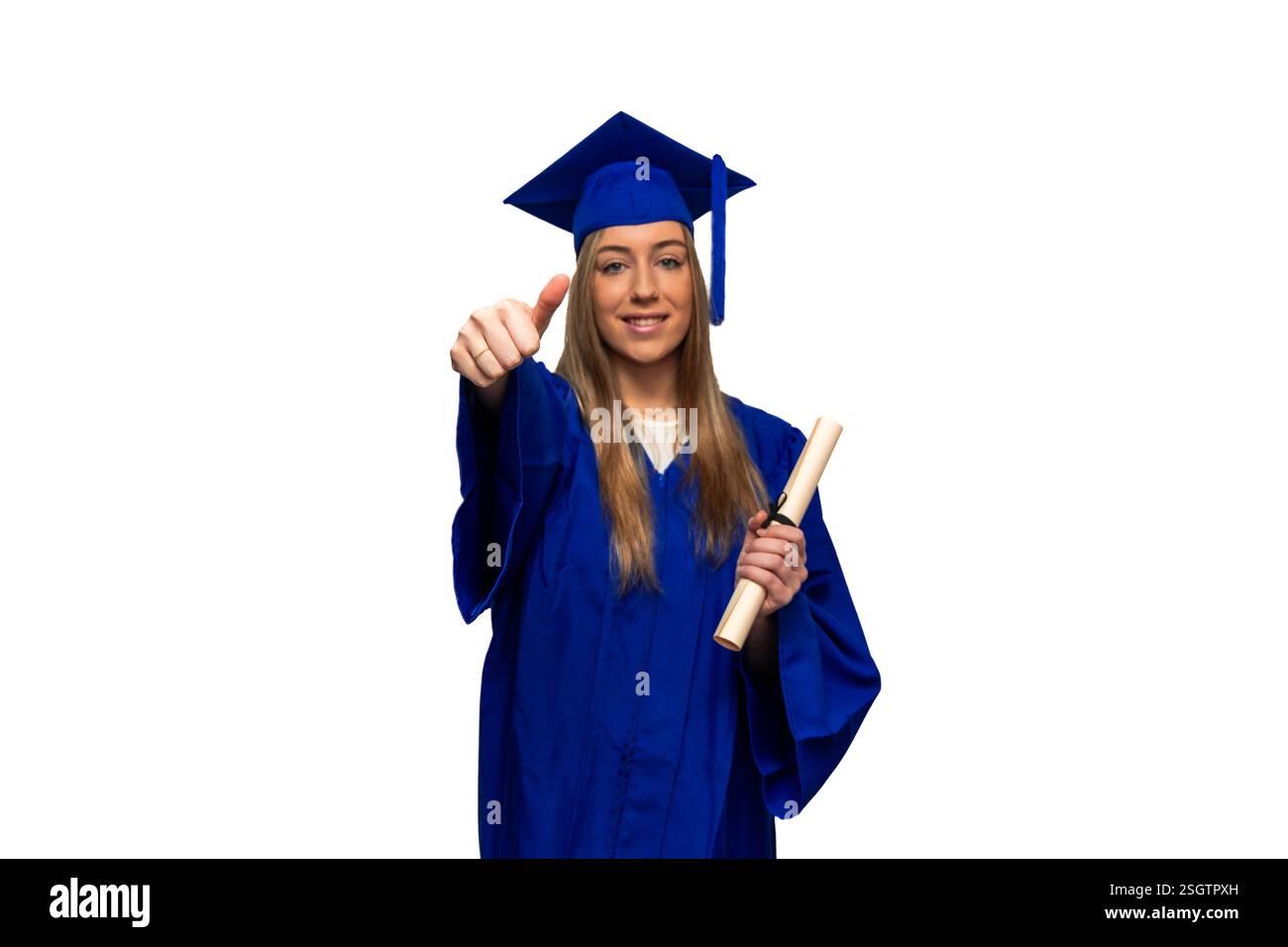 Portrait of a young female student wearing blue graduation gown showing ...