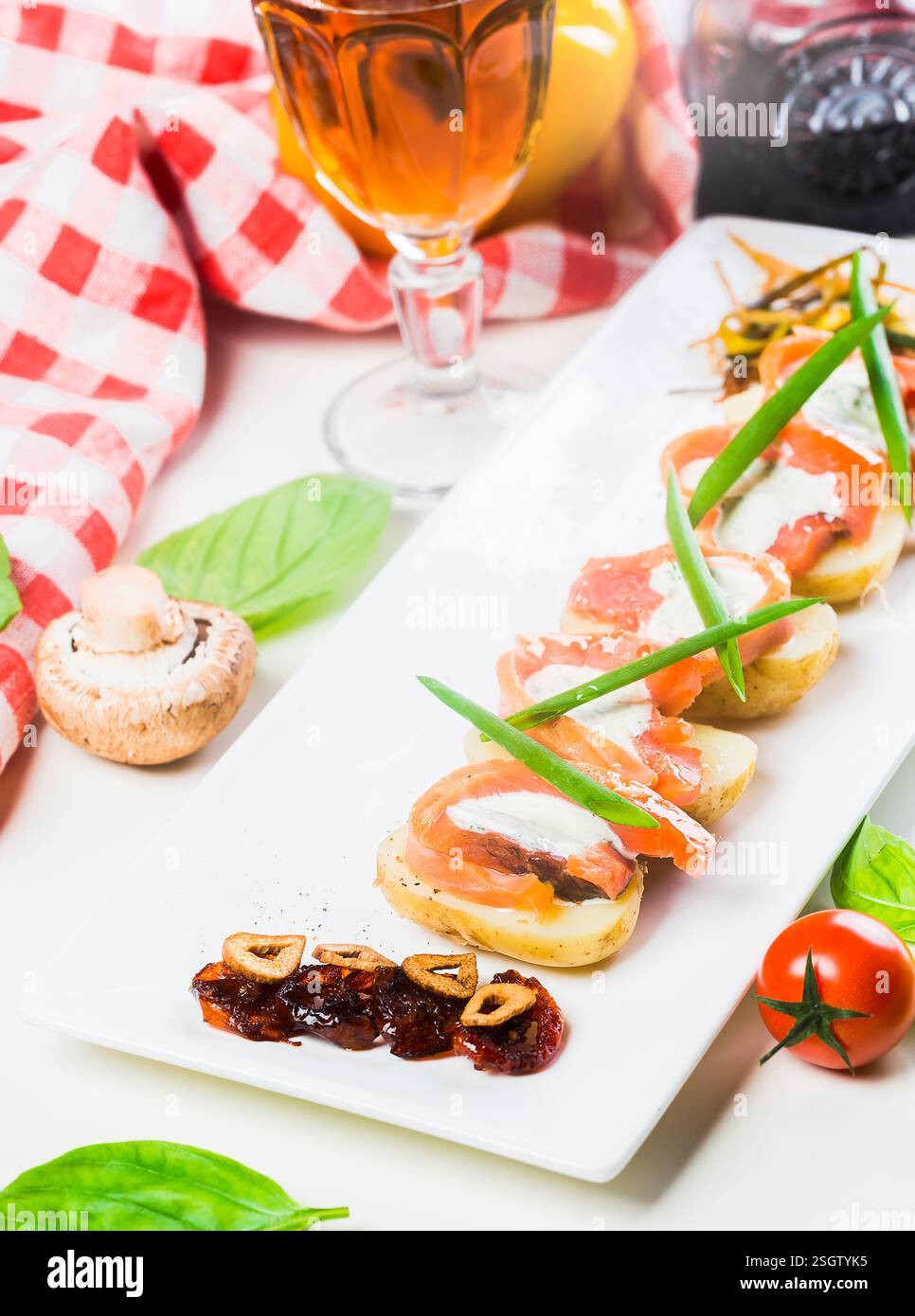 Gourmet appetizer platter featuring smoked salmon, creamy topping, and ...