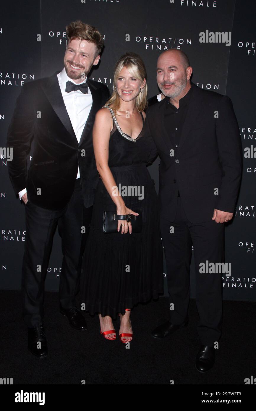Writer Matthew Orton, Melanie Laurent and Lior Raz arriving at the premiere of 'Operation Finale ...