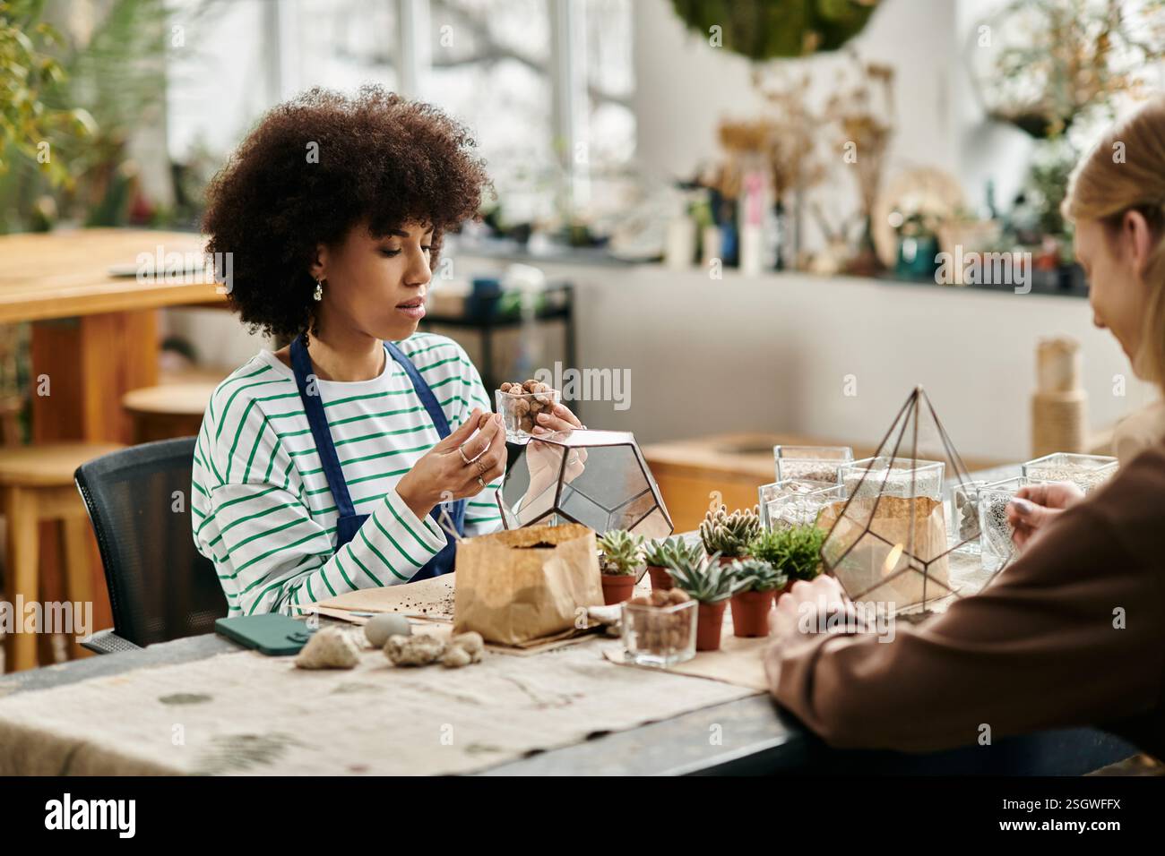 Friends engage in a fun workshop, crafting unique succulent ...