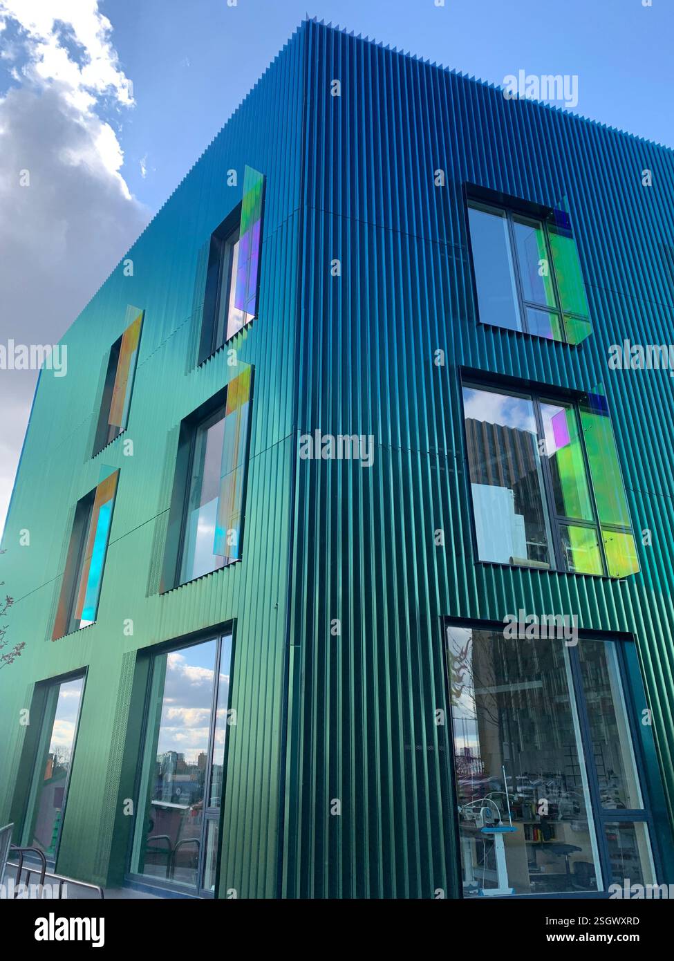 Iridescent green ridged building in Design District Greenwich Stock ...