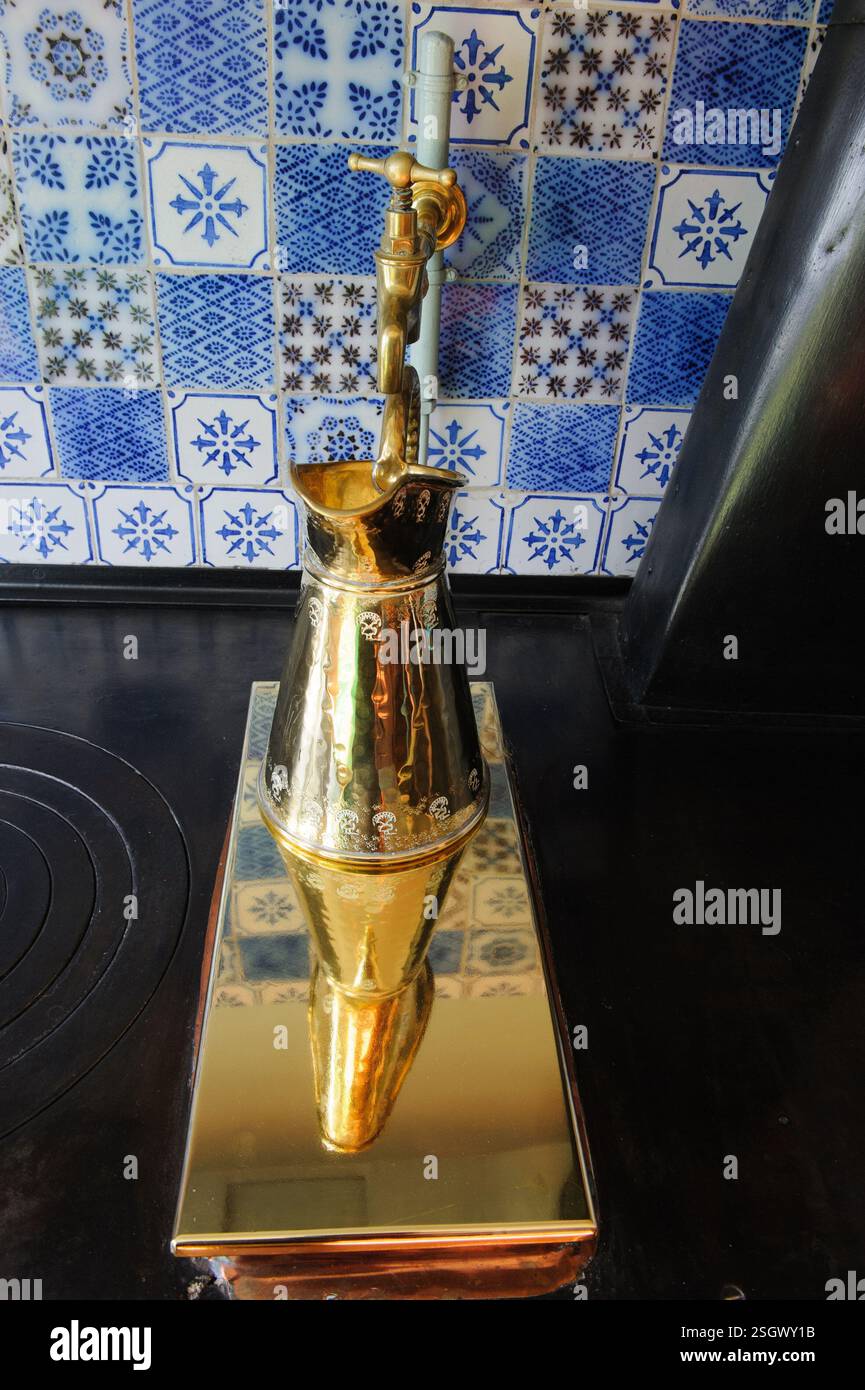 A shiny, antique, copper water pitcher in the kitchen of the former ...