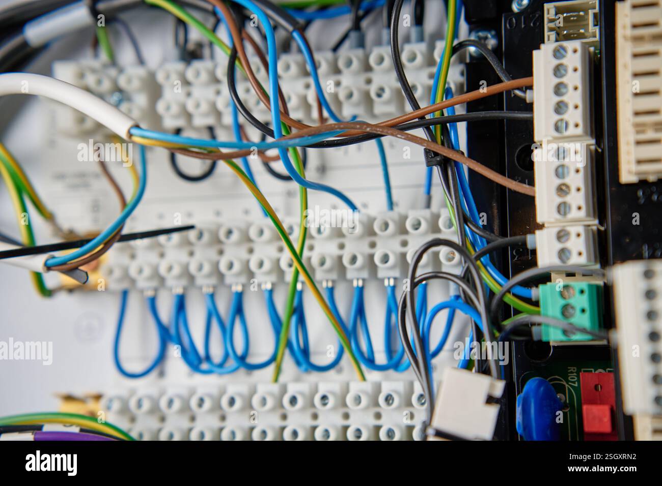 Colorful wires and components connected to terminal block in ...