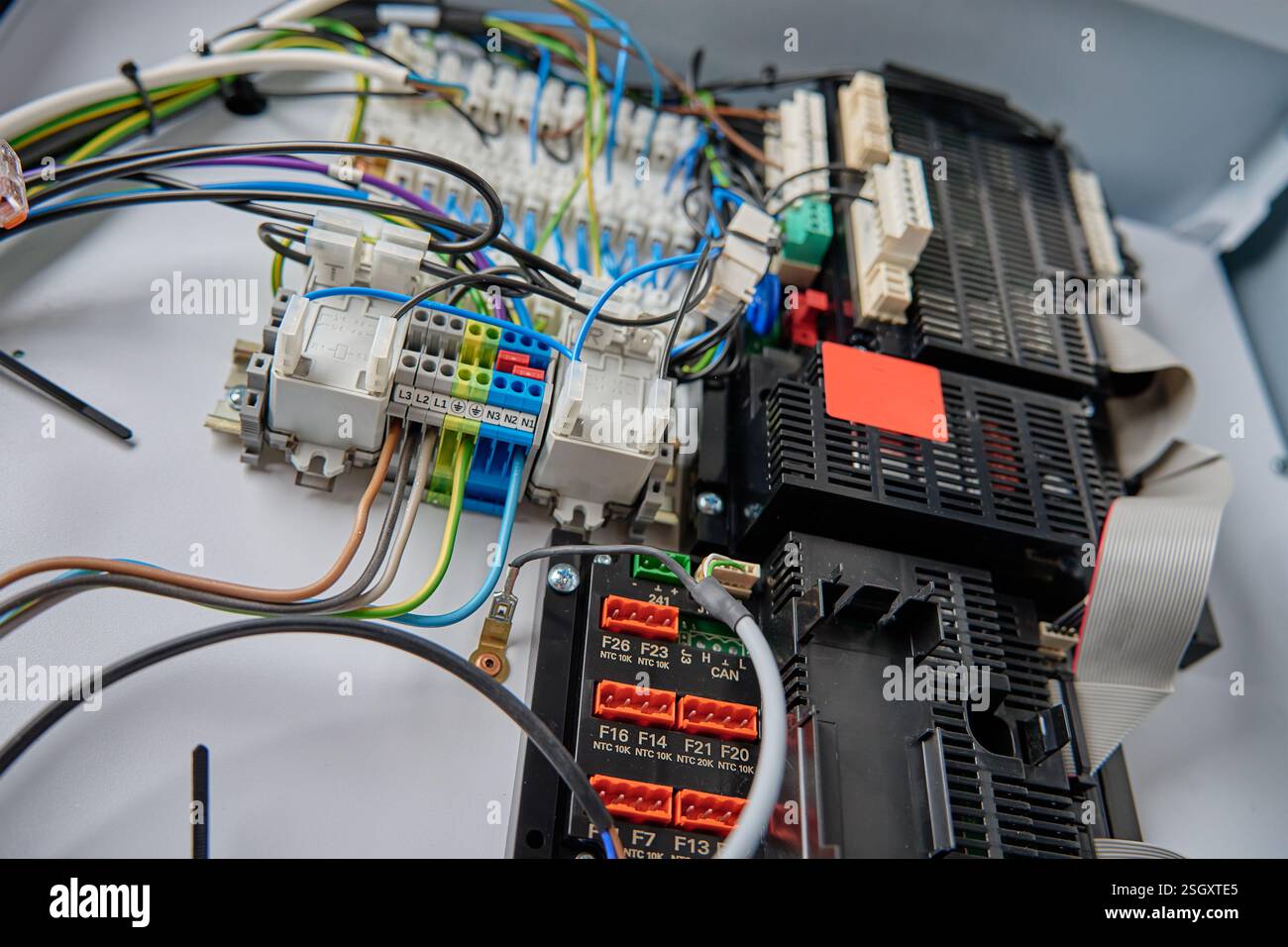 Close-up view of wiring system and circuit board inside electrical ...