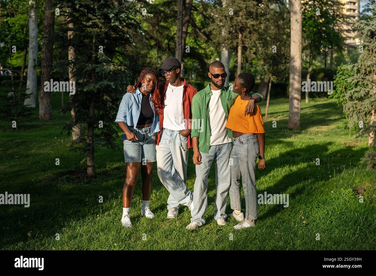 Young multiracial group of friends travel together, stand and posing ...