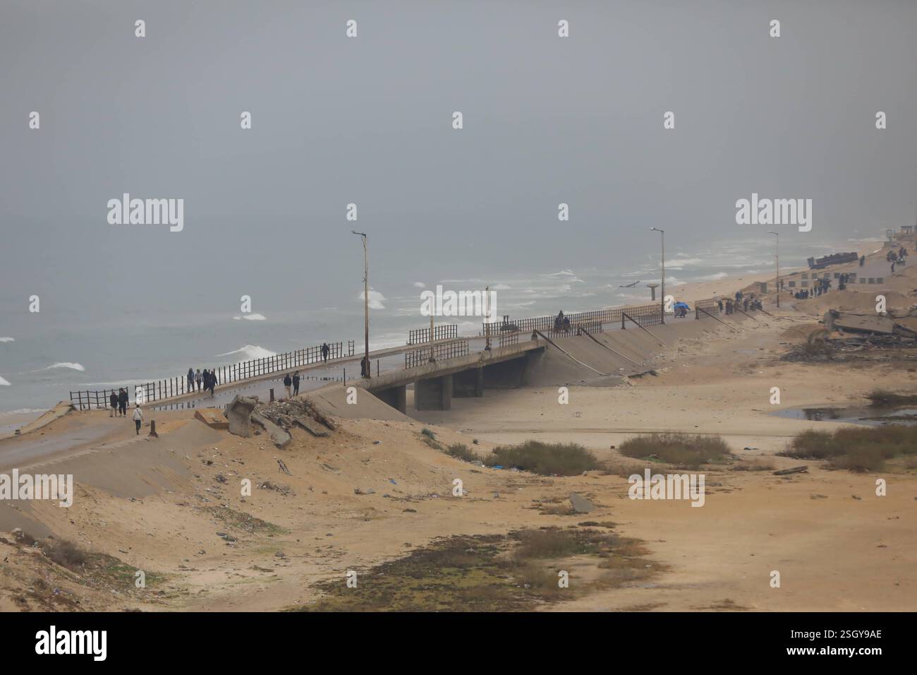 People walk along al-Rashid street between Gaza City and Nuseirat in ...