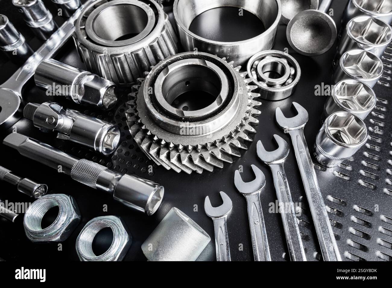 Metal tools arranged neatly on a workbench highlighting their features ...
