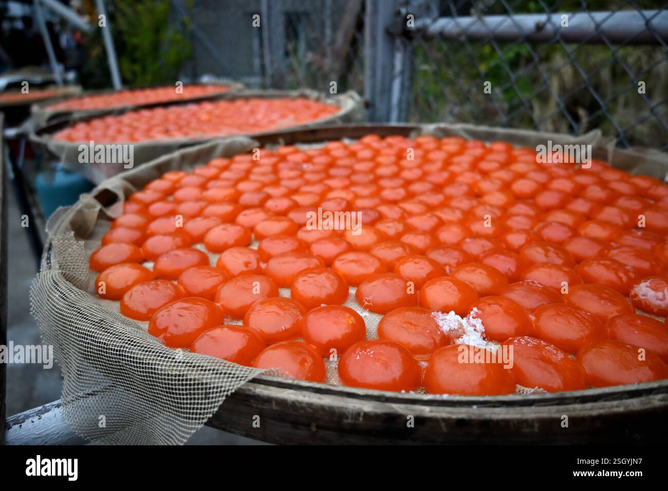 Traditional food: Raw and sun-dried salted egg yolk Stock Photo - Alamy