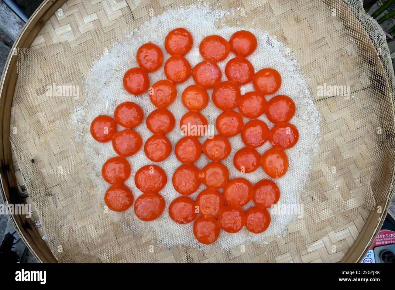 Traditional food: Raw and sun-dried salted egg yolk Stock Photo - Alamy