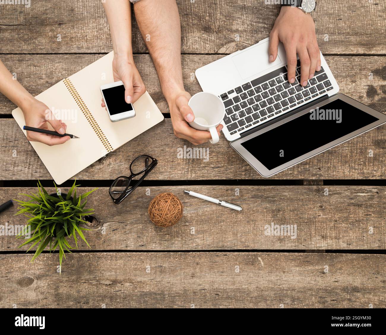 Collaborative workspace with technology, stationery, and a touch of ...