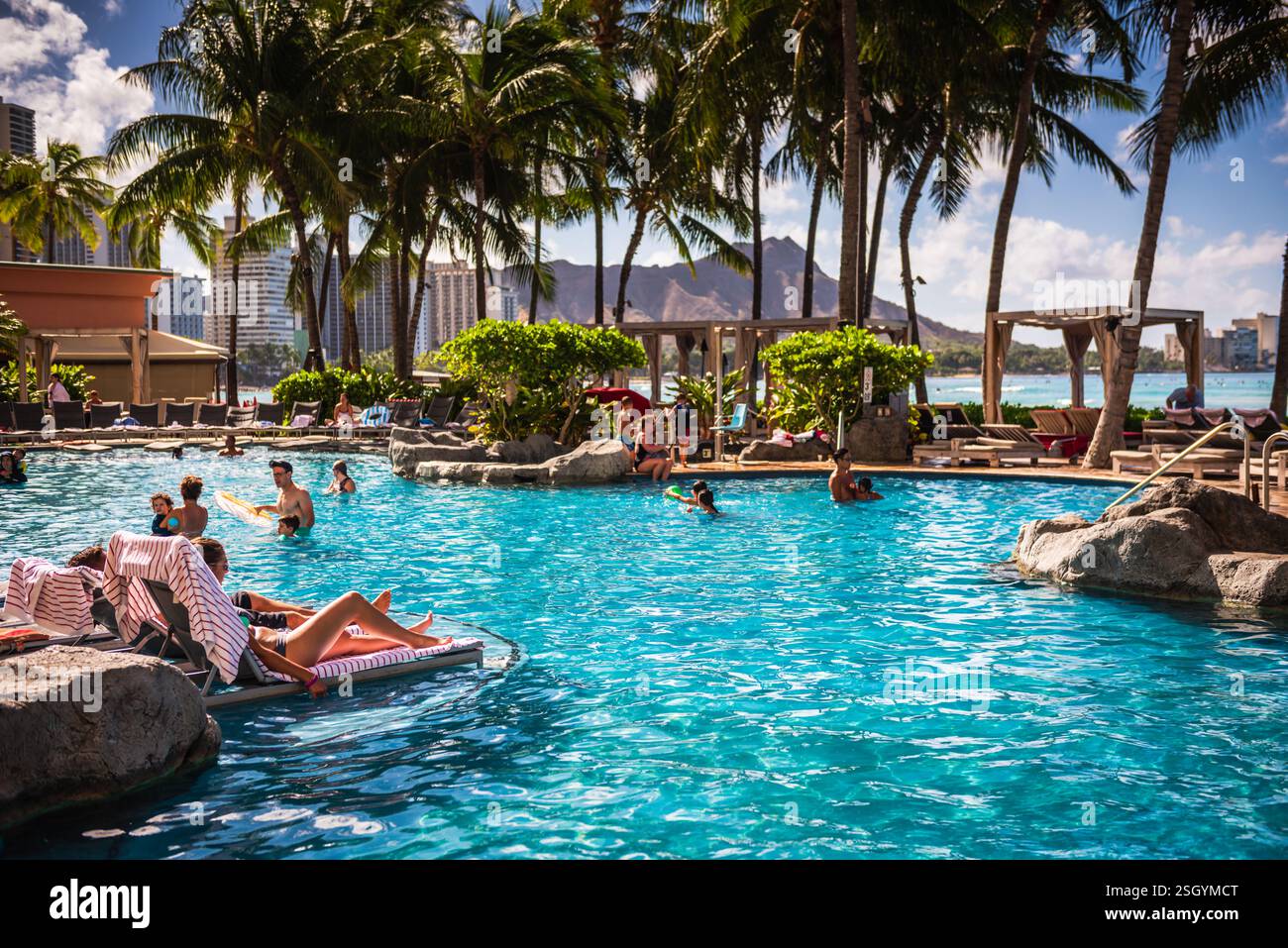 Honolulu, Hawaii - USA - August 30, 2018: Sunbathers lounging by the ...