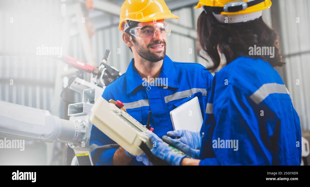Engineers mechanic using computer controller Robotic arm for welding ...