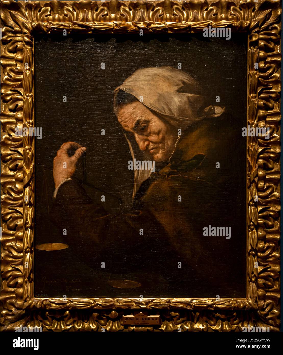 Paris, France - 02 09 2025: Darkness and light. An Old Usurer painted ...