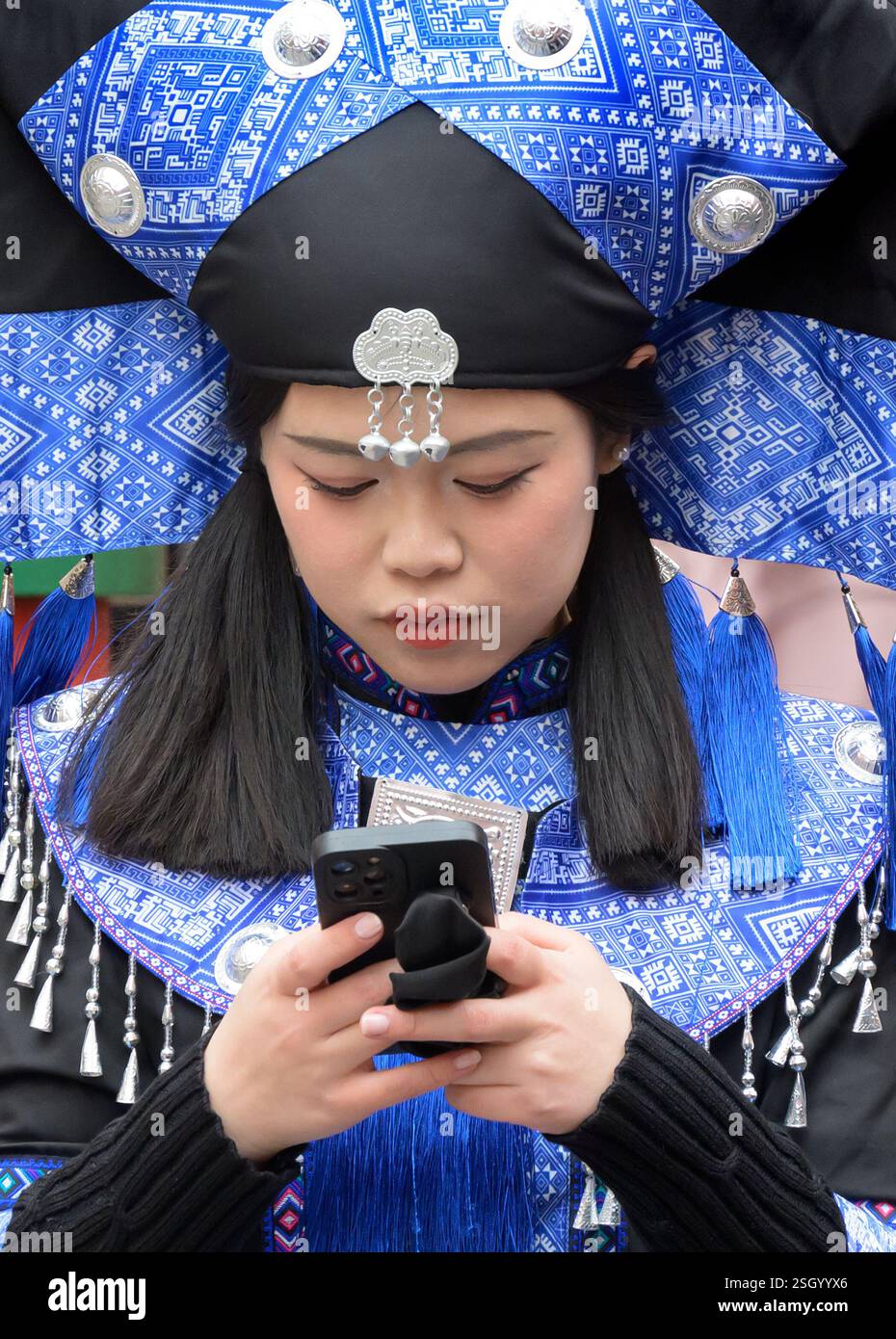 London, UK. Young Chinese woman in Chinatown wearing tradition costume ...