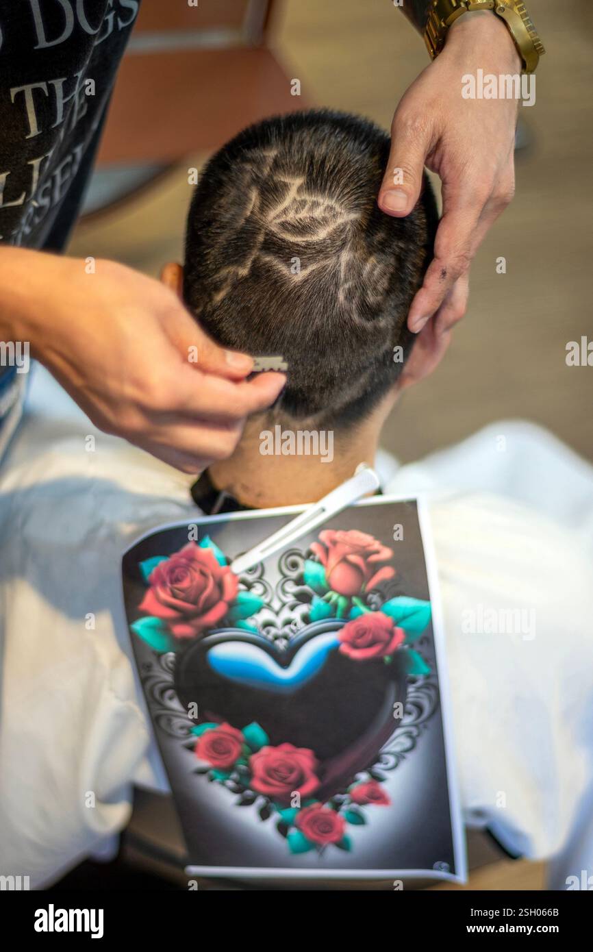 Chiang Mai, Thailand. 10th Feb, 2025. A male customer getting a rose ...